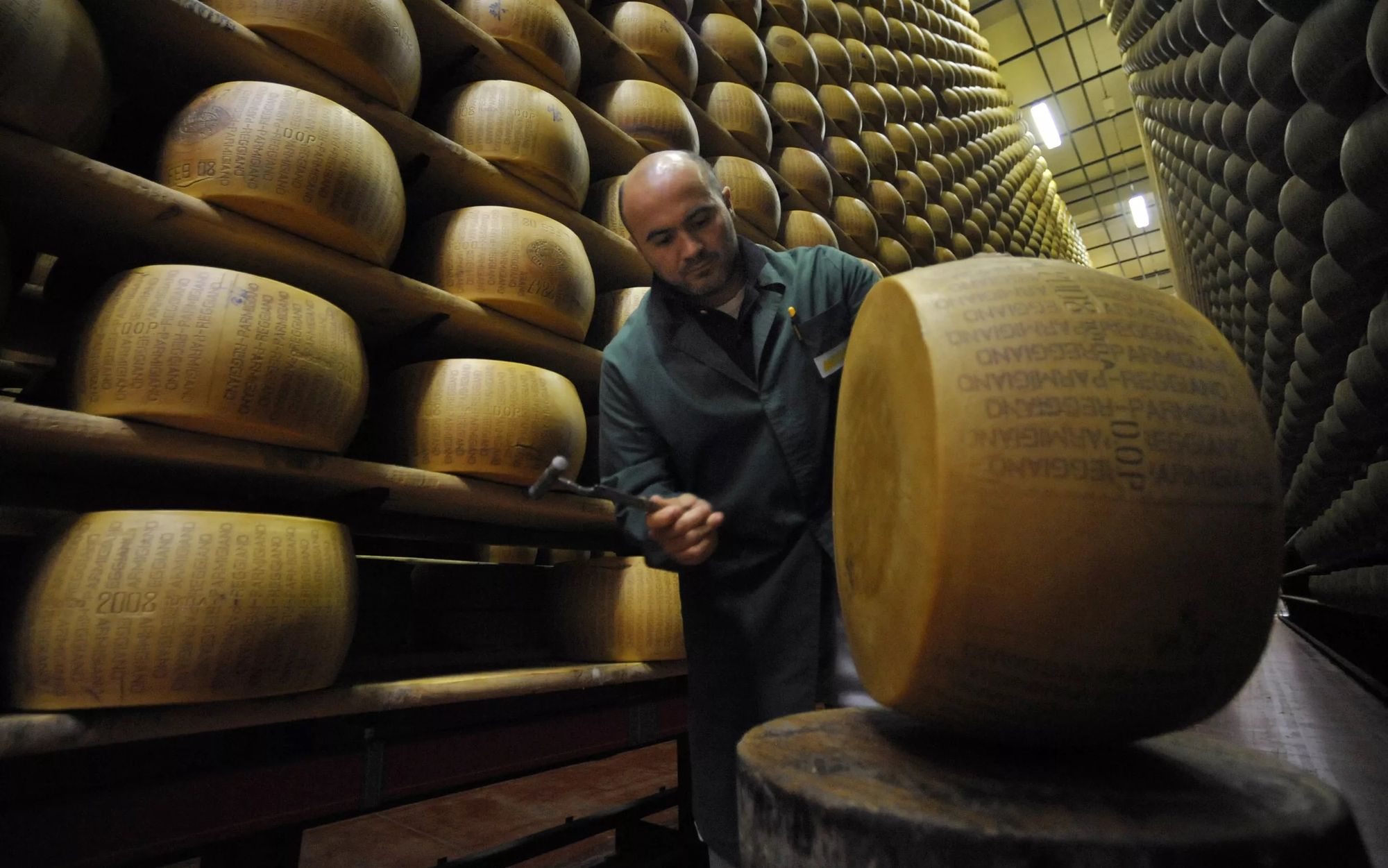 Cheesemakers are embedding tiny tracking chips in parmesan to tackle ...